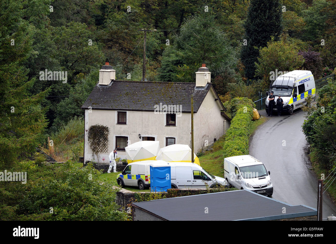 Police outside the home of Mark Bridger, 46, who appeared in court ...