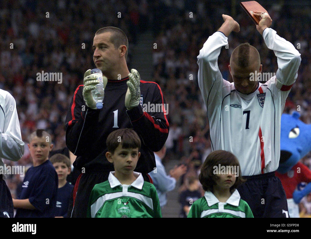 England captain David Beckham (right) and keeper Nigel Martin aplaude ...