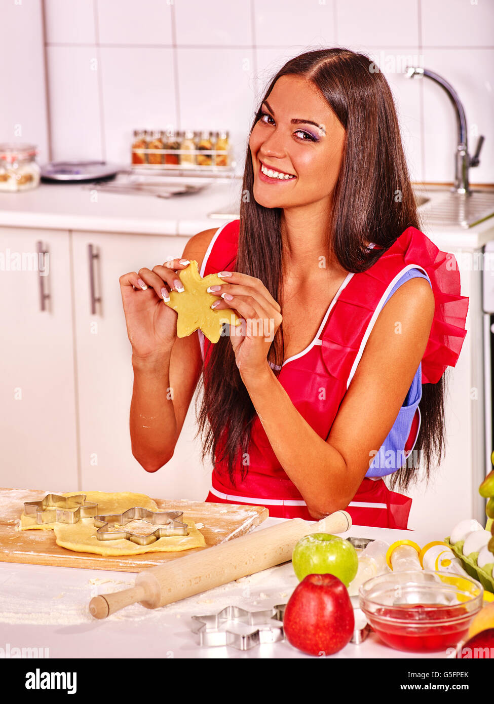 Young woman baking cookies in oven Stock Photo - Alamy