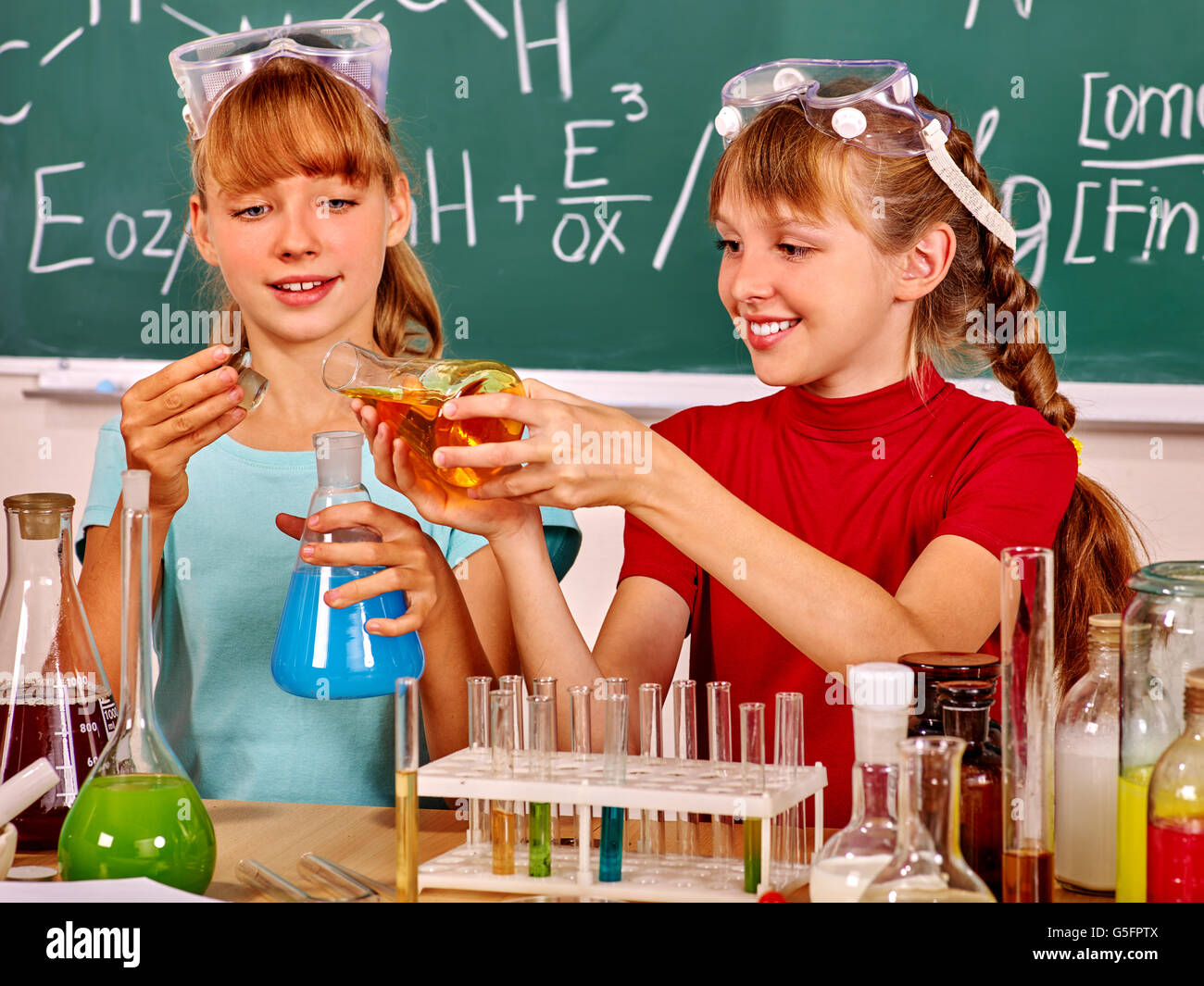 Children holding flask in chemistry class Stock Photo - Alamy