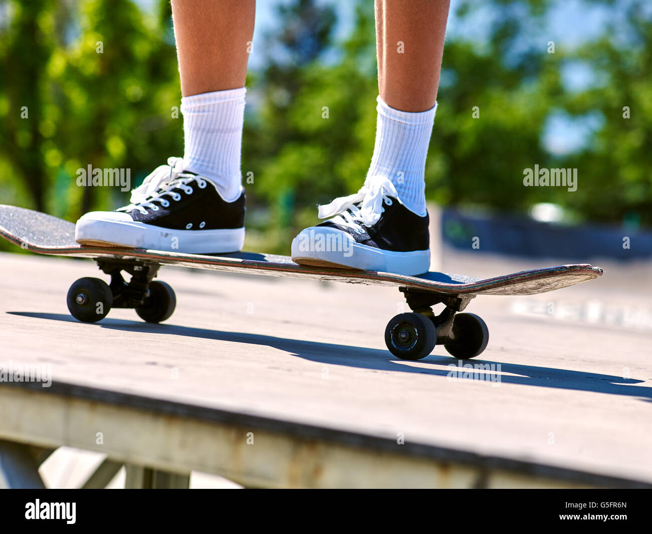 Girl riding on roller skates Stock Photo - Alamy