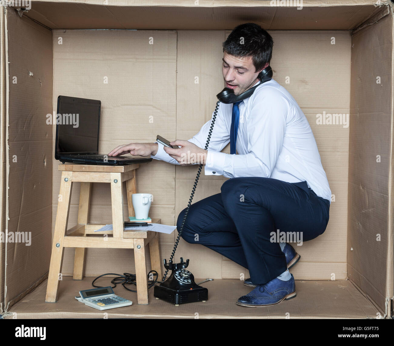 businessman doing several things at once Stock Photo - Alamy