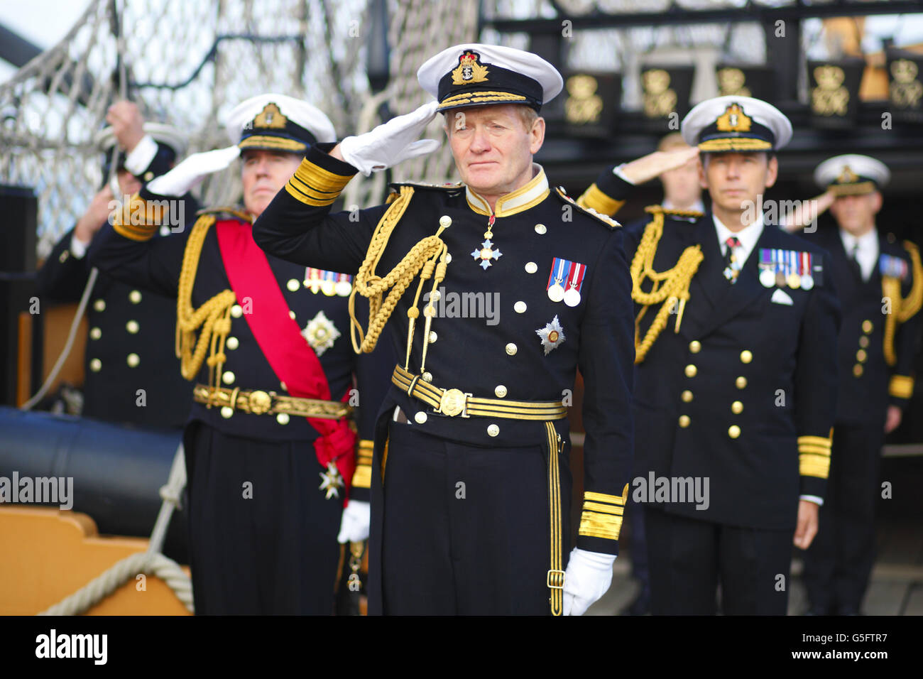 The Second Sea Lord, Vice Admiral Sir Charles Montgomery, watches as ...