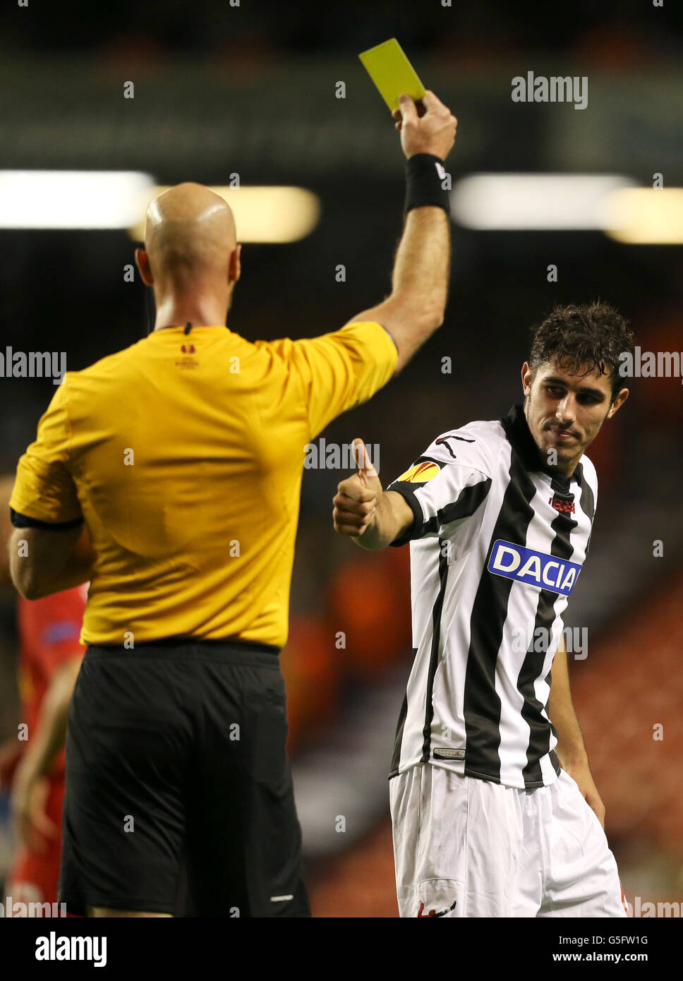 Referee johannesson shows the yellow card to udineses davide faraoni hi ...