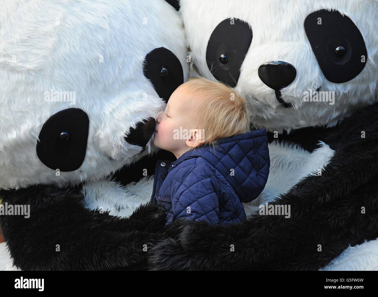 Getting a cuddle from the giant pandas on princes street hi-res stock ...