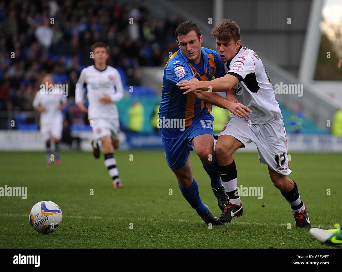Walsall's George Bowerman (right) and Shrewsbury Town's Lee Collins ...
