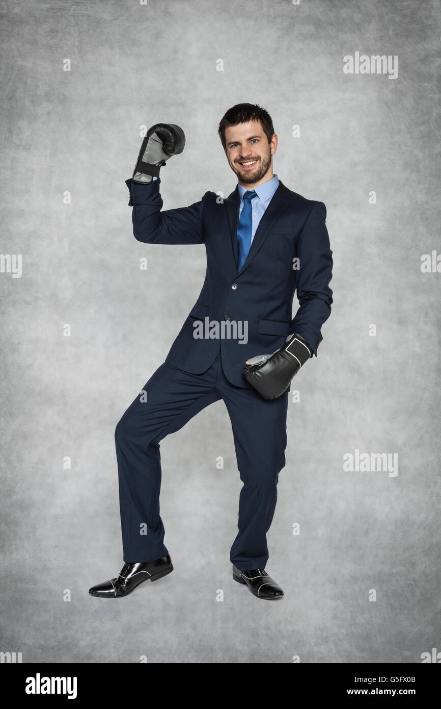 businessman showing his muscles Stock Photo - Alamy