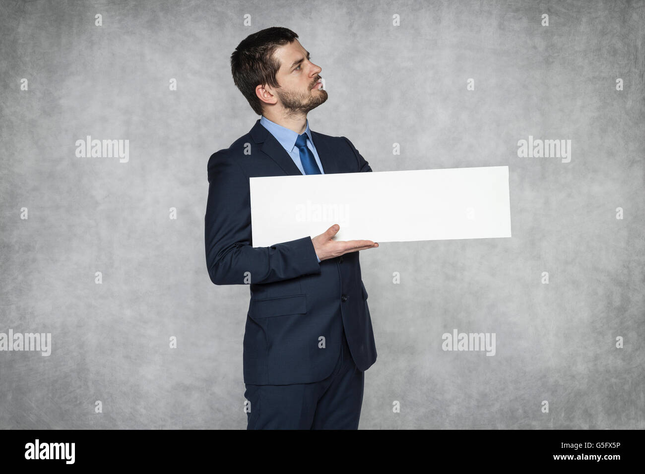proud businessman holding advertisement Stock Photo - Alamy