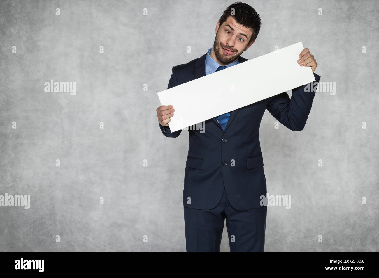 Funny businessman with a piece of paper Stock Photo - Alamy