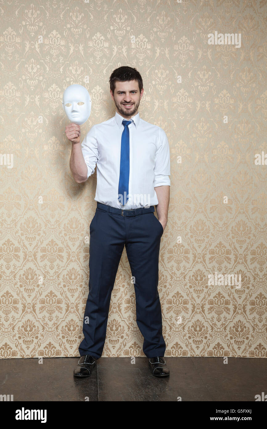 businessman shows his second face Stock Photo - Alamy