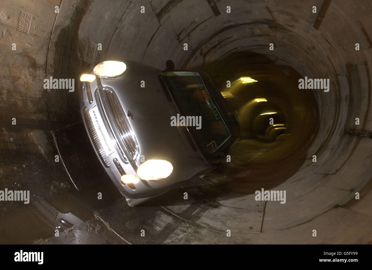 A Mini Cooper drives 20 metres through a Yorkshire Water sewerage ...