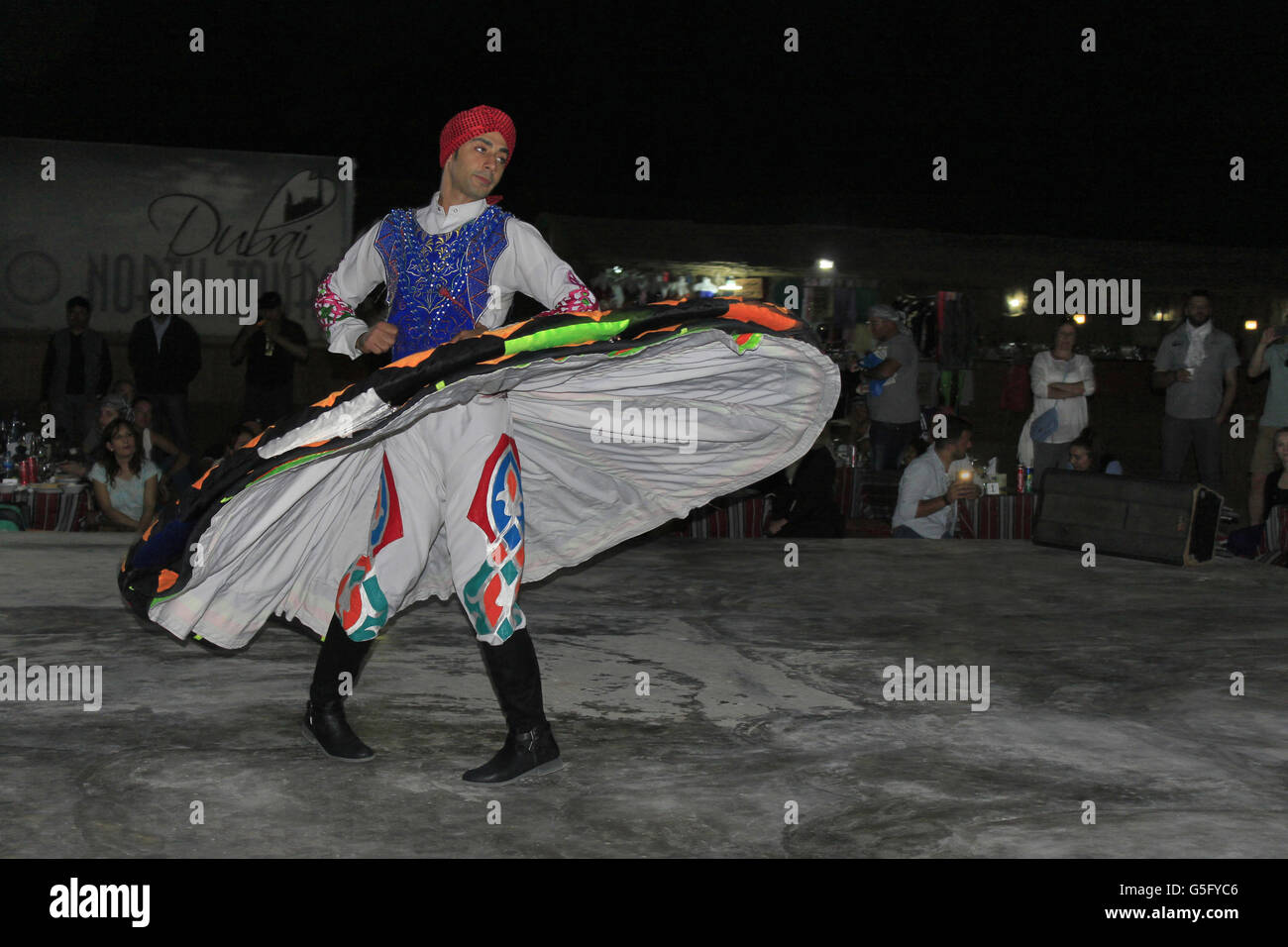 The Tanoura Dance, at Sundowner Dune Dinner Safari, Dubai, UAE Stock ...