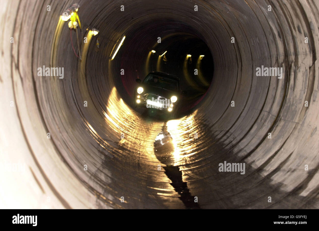 A Mini Cooper drives 20 metres through a Yorkshire Water sewerage ...