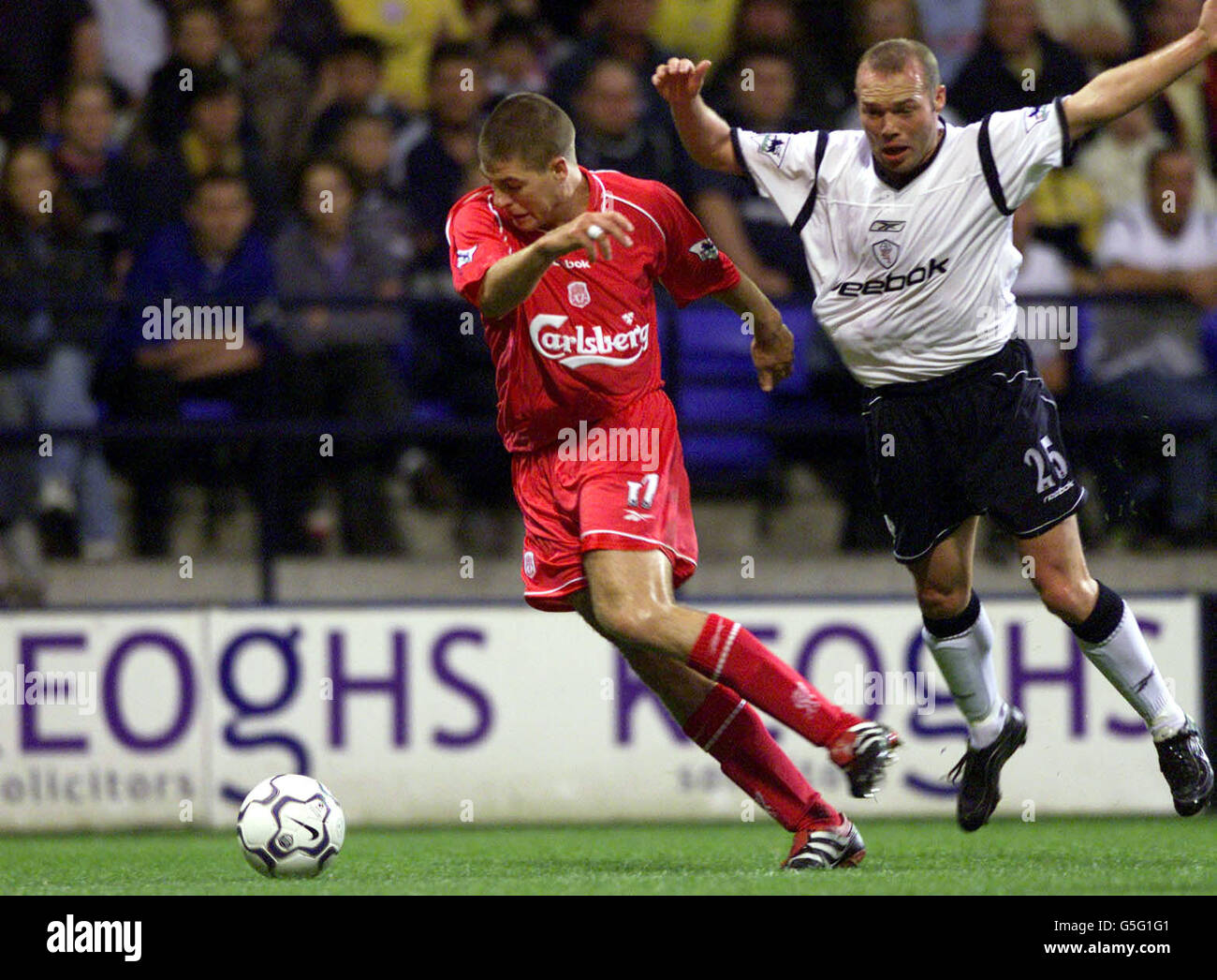 Liverpool's Steven Gerrard (left) gets away from Bolton Wanderers ...