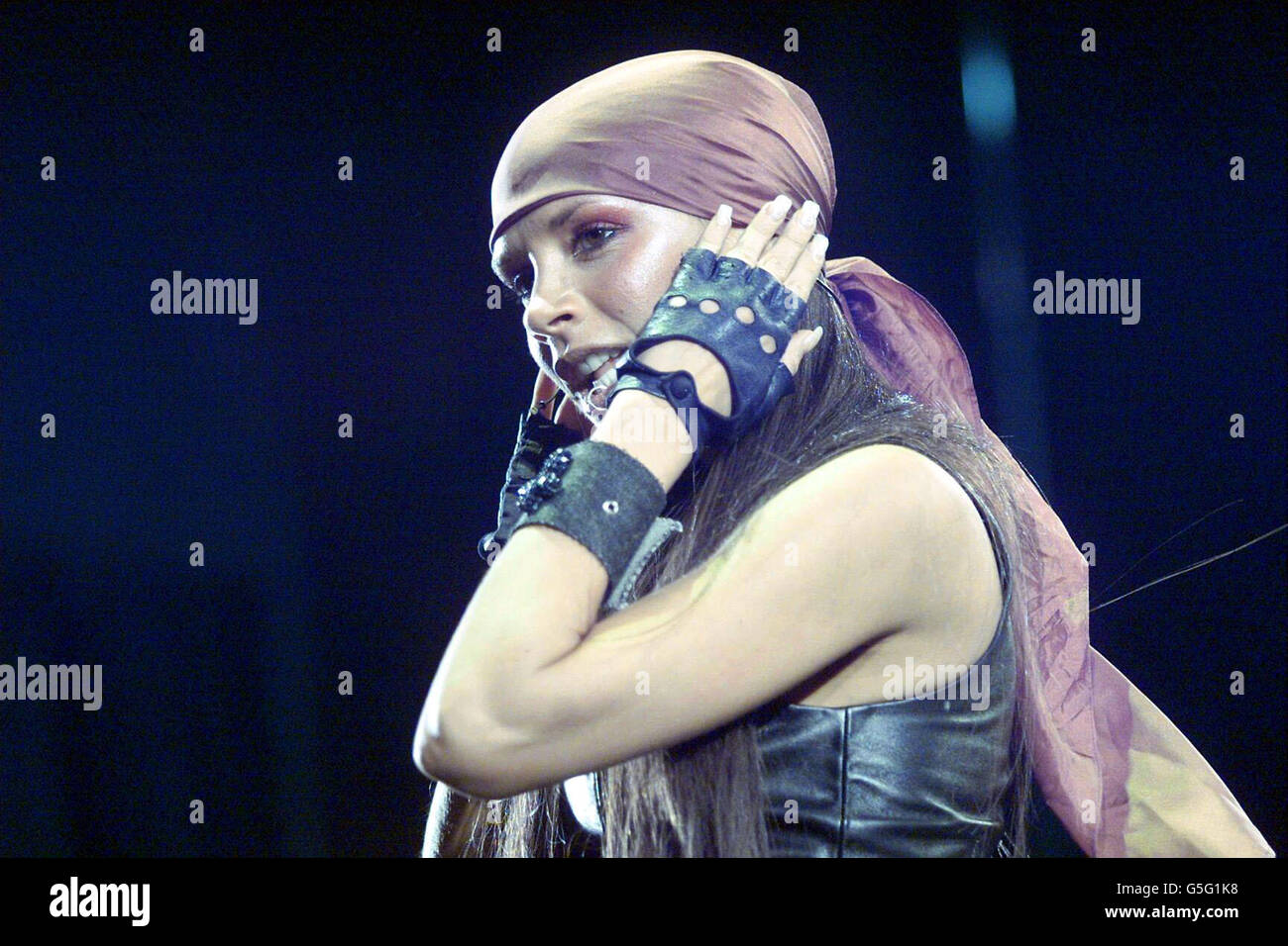 Music celebrity performing singing head shoulders head scarf victoria ...