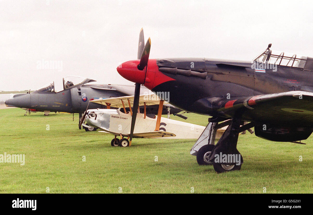 Pictured side by side, the Hawker Cygnet biplane of 1924 (middle) and a ...