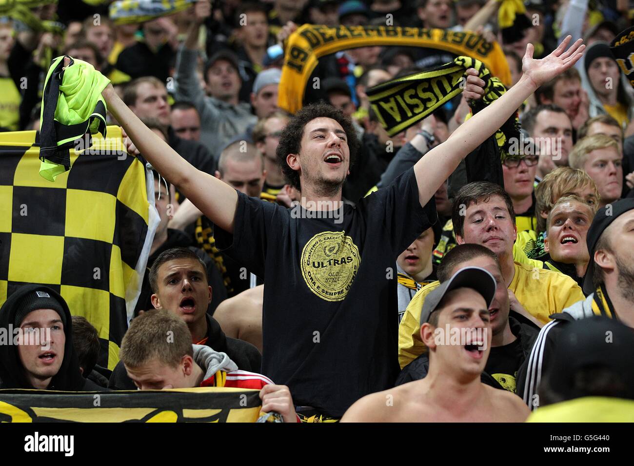 Borussia dortmund fans in celebratory mood in the stands hi-res stock ...