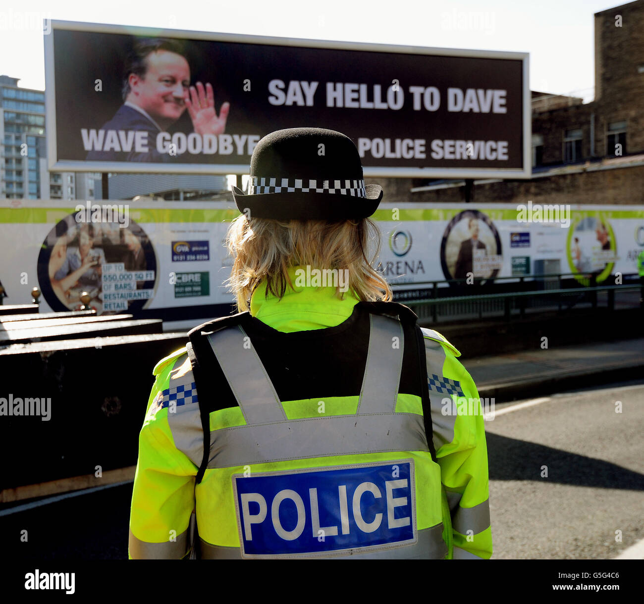 A billboard against police cuts in Birmingham during the first day of ...