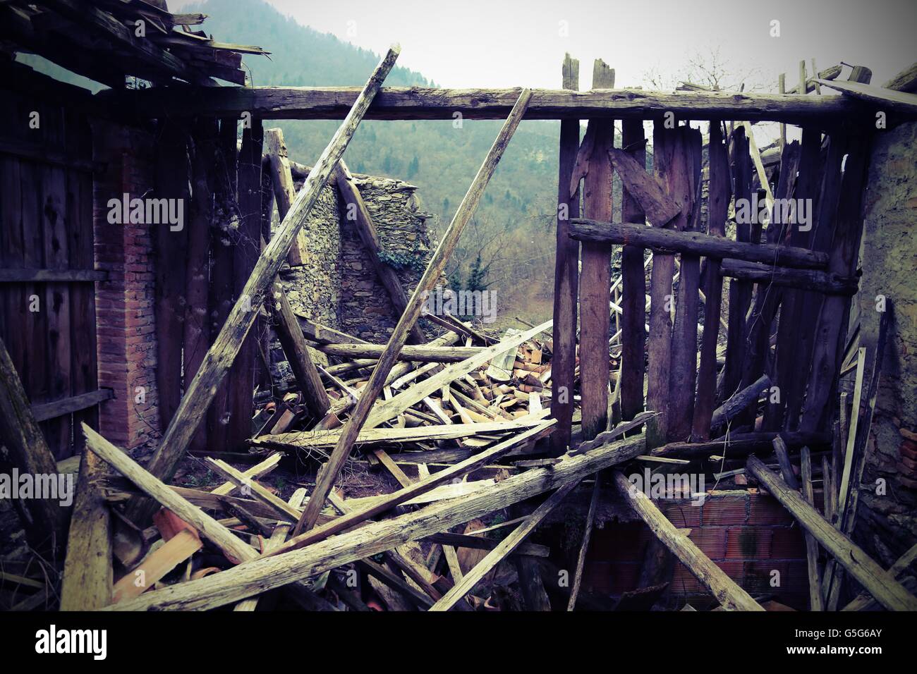 wooden planks and rubble and the ruins of the house completely ...