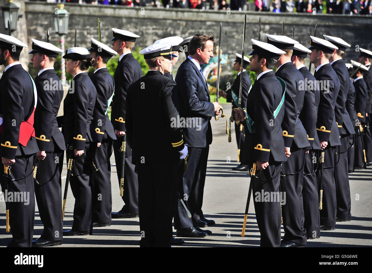 Prime Minister David Cameron talks to Naval cadets during a passing out ...