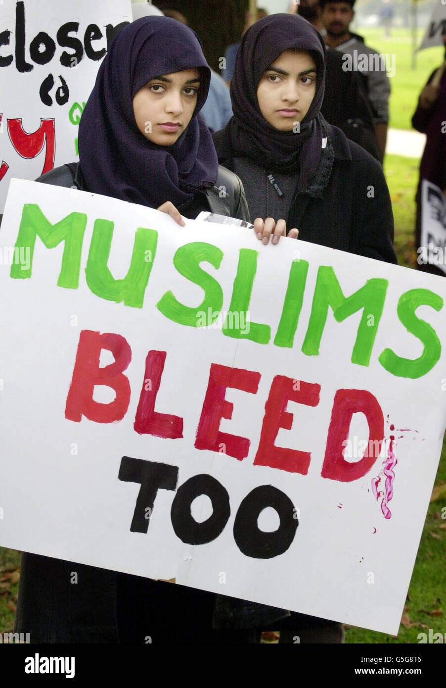 Two muslim girls demonstrate in London, as part of a march organised by ...