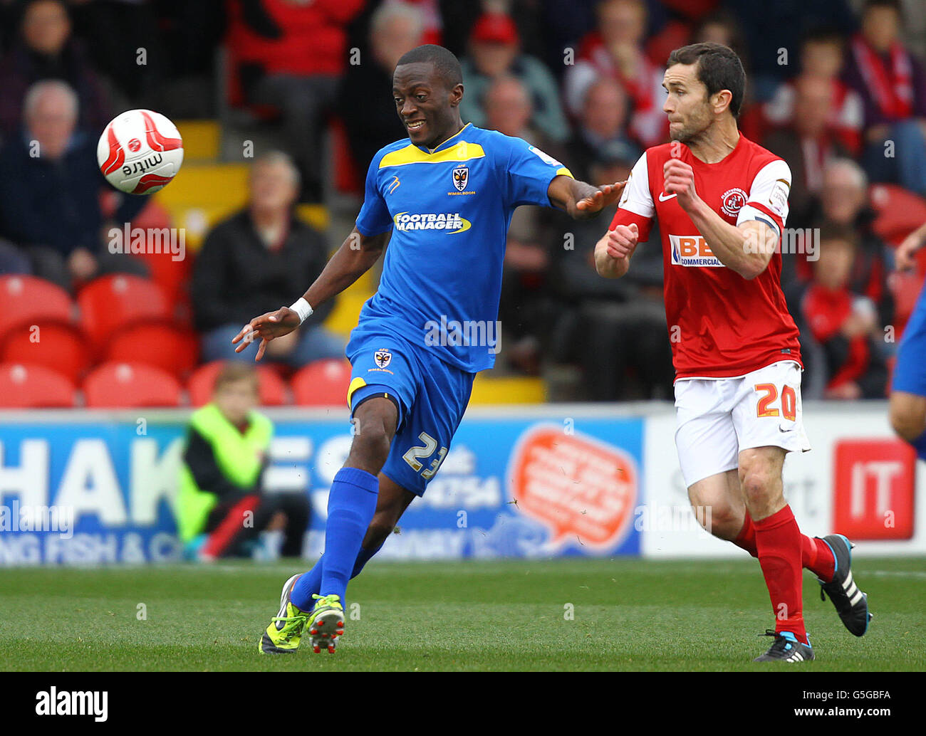 Fleetwood Town's Damien Johnson and AFC Wimbledon's Rashid Yussuff ...
