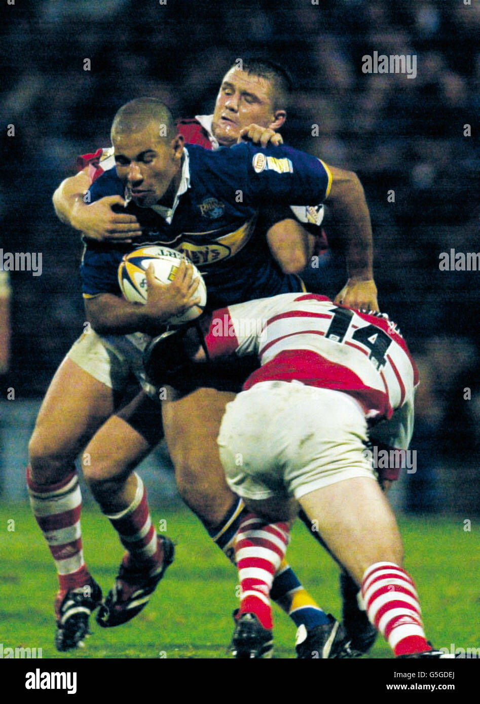 Leeds' Chev Walker (centre) is challenged during the Tetley's Bitter ...
