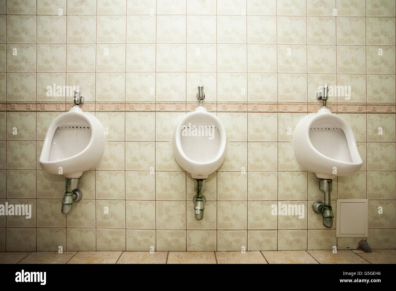 Urinals for men Stock Photo - Alamy