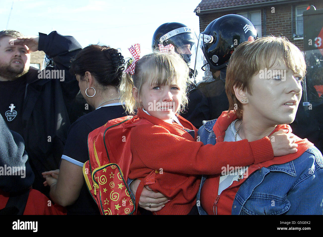 Comforted by mother escorted holy cross school hi-res stock photography ...