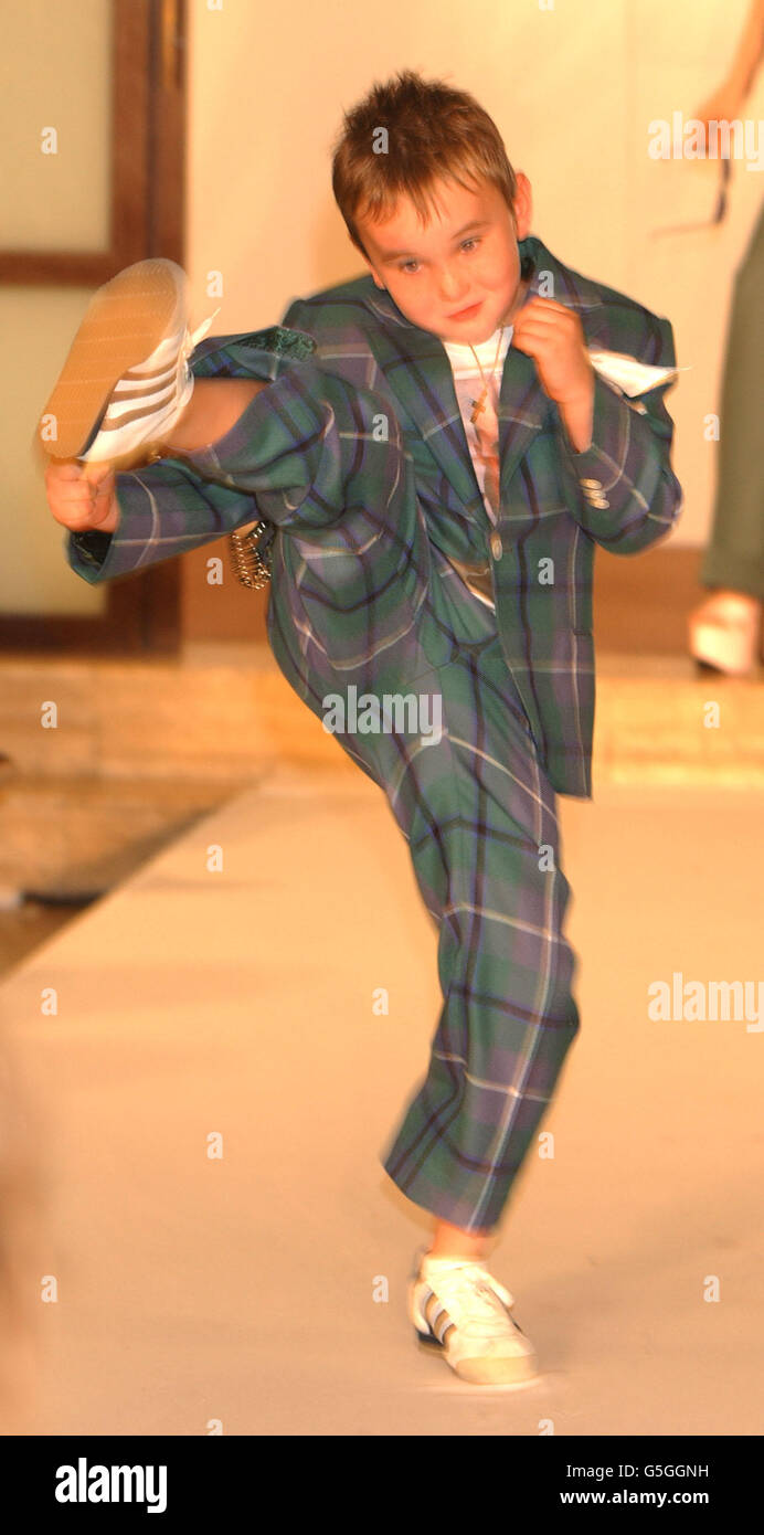 Max Powell, the young son of bespoke tailor Mark Powell, who is ...