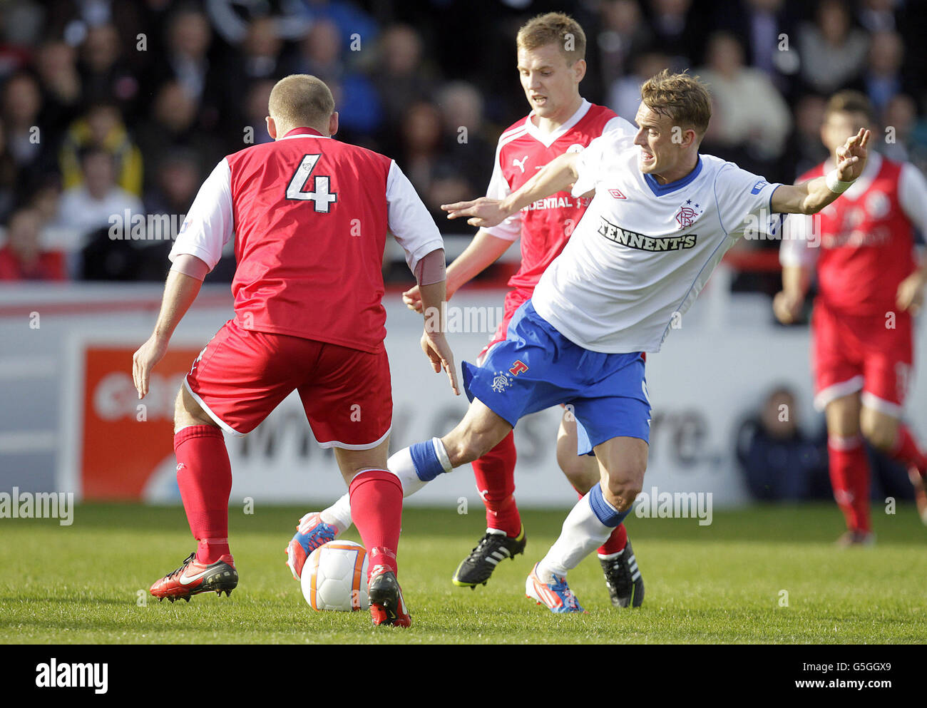 Stirling Albion's Marc McCulloch (left) and Rangers' Dean Shiels battle ...