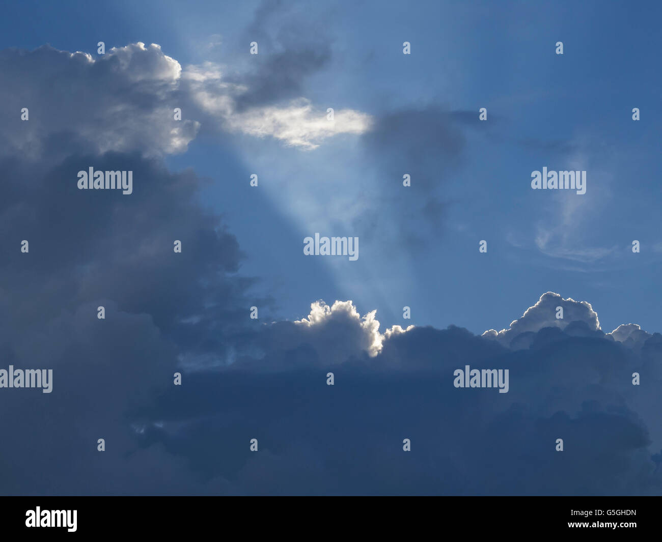 Blue sky with clouds and sun rays Stock Photo - Alamy