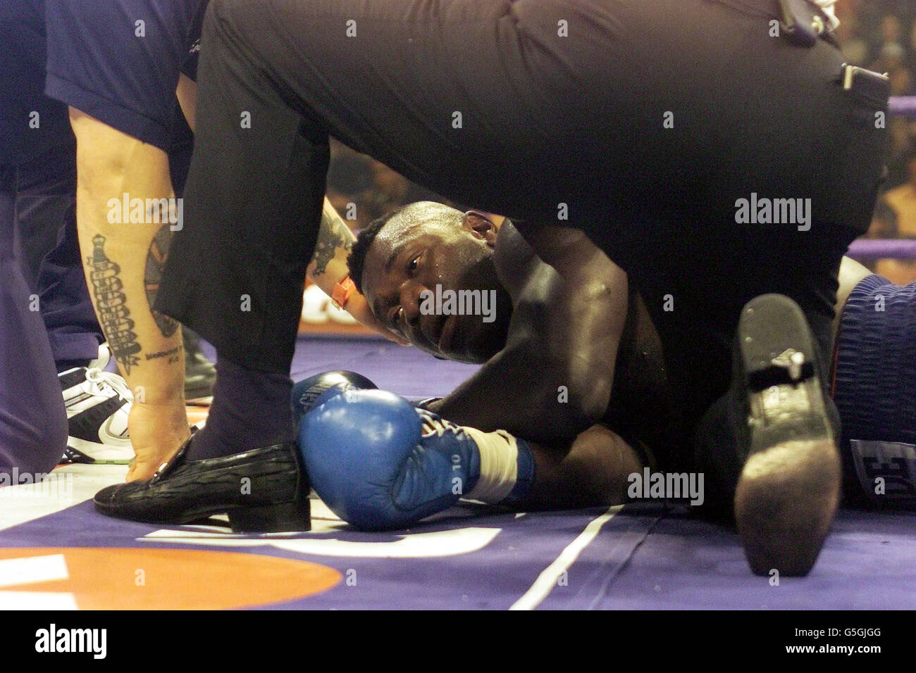Great Britain's Herbie Hide (right) is knocked down by Zambia's Joseph ...