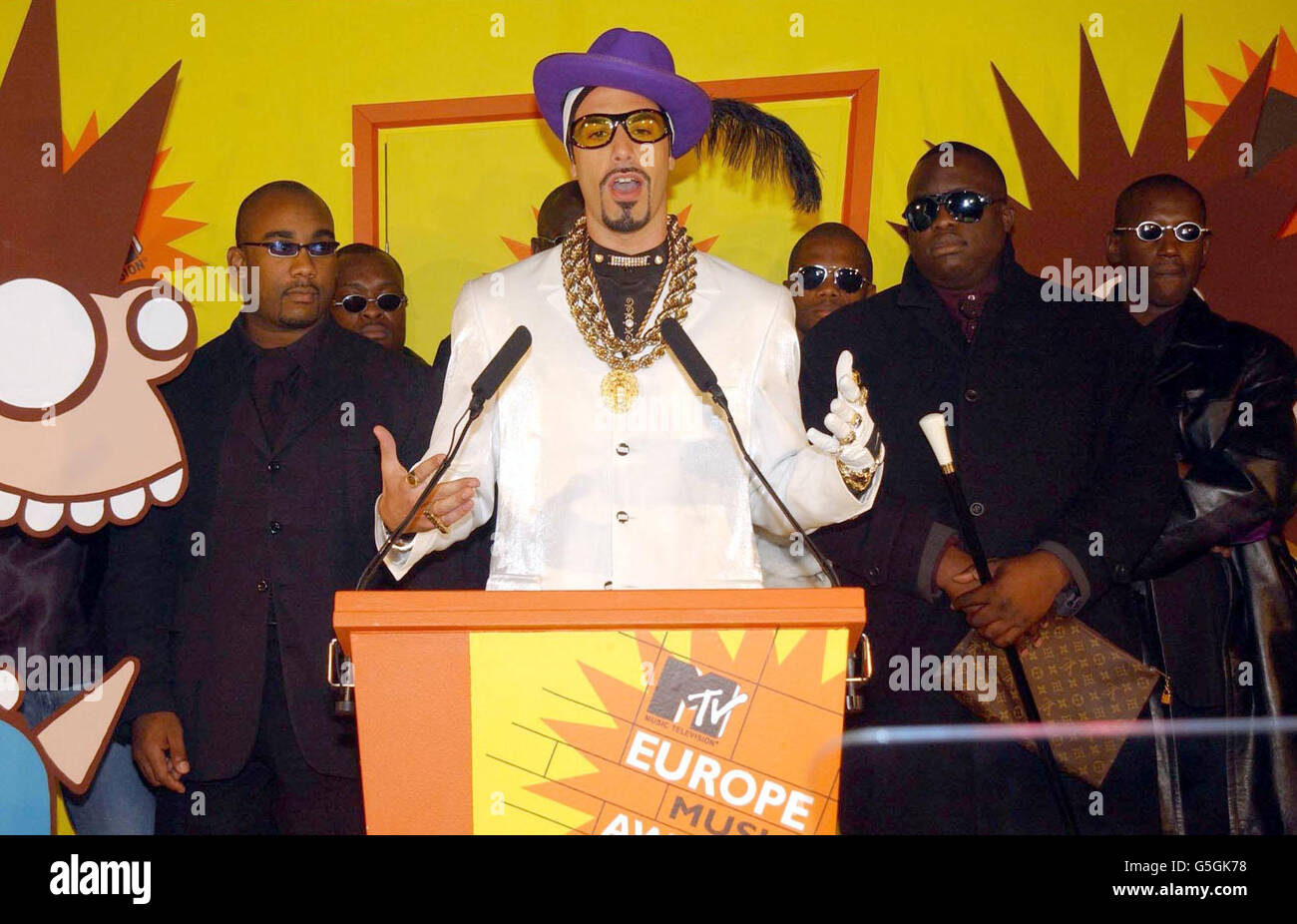 Comic Ali G flanked by henchmen from the Staines Massive during a ...