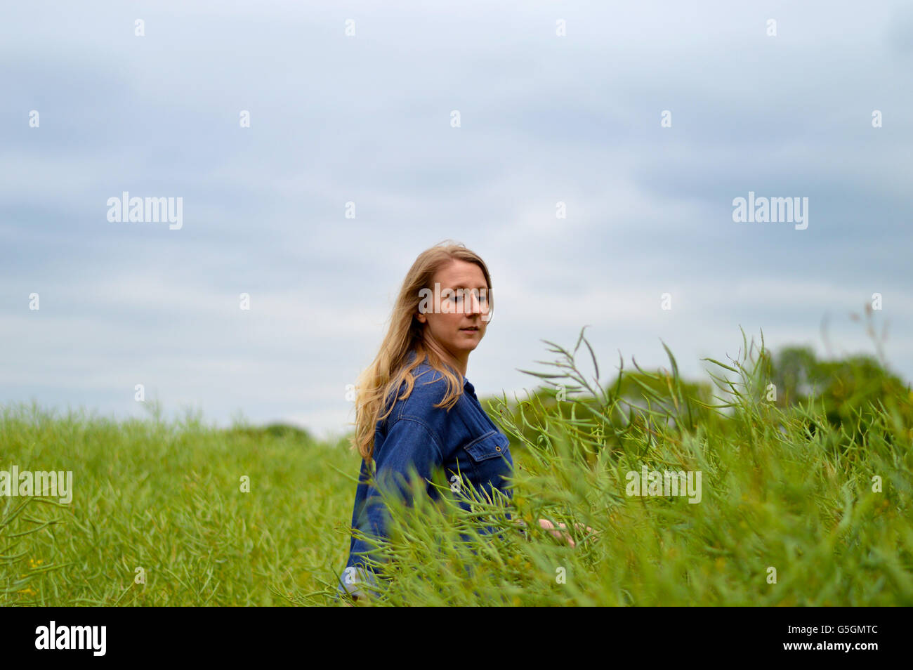 Blond woman in the British countryside Stock Photo - Alamy