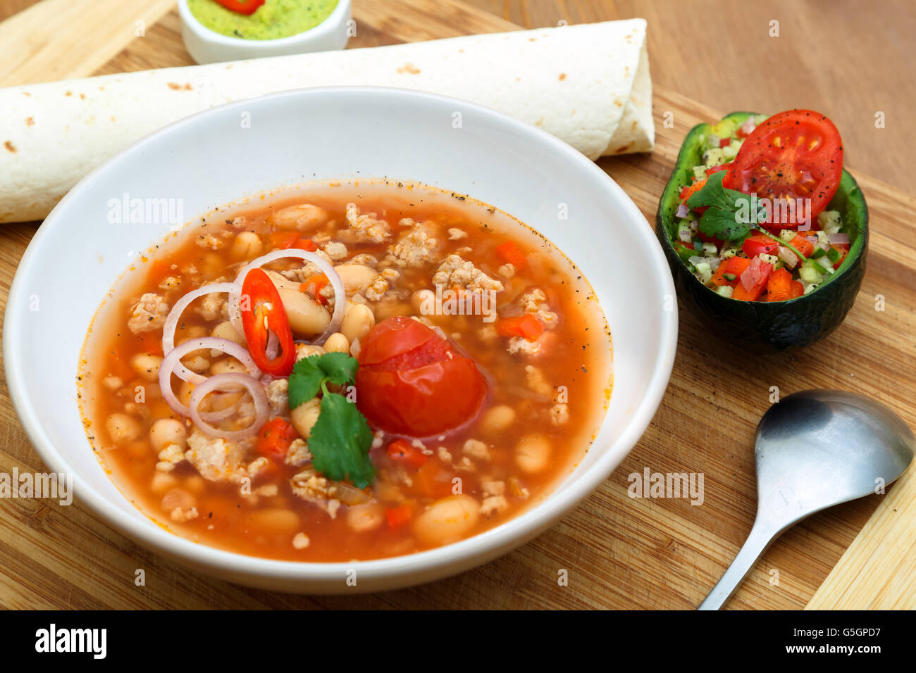 chili con carne soup garnish with tortilla, guakomolle and salad Stock ...
