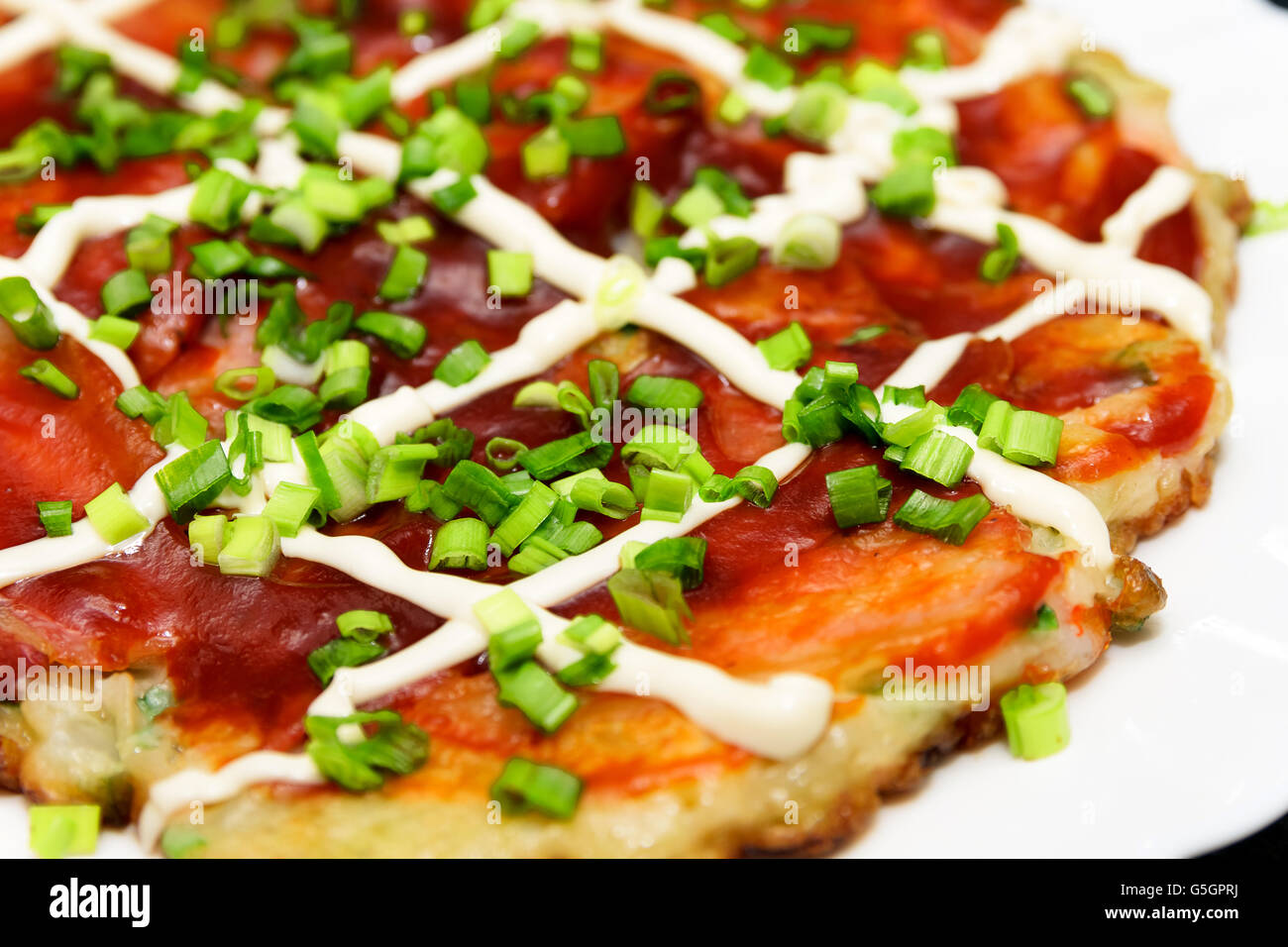 okonomiyaki Osaka style with mayonnaise, onion and sauce Stock Photo ...
