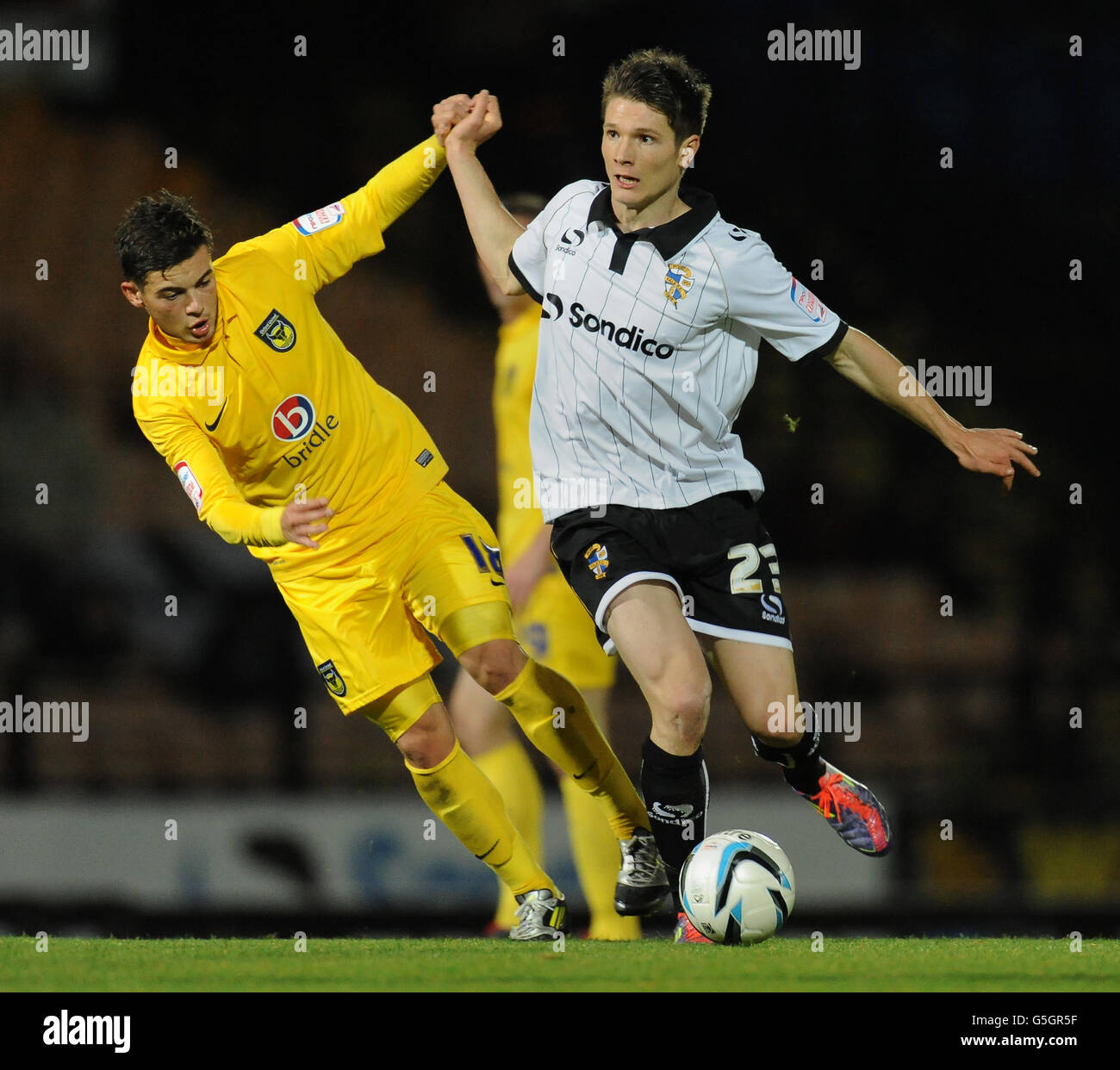 Port Vale's Ryan Burge (right) and Oxford United's Jake Forster-Caskey ...
