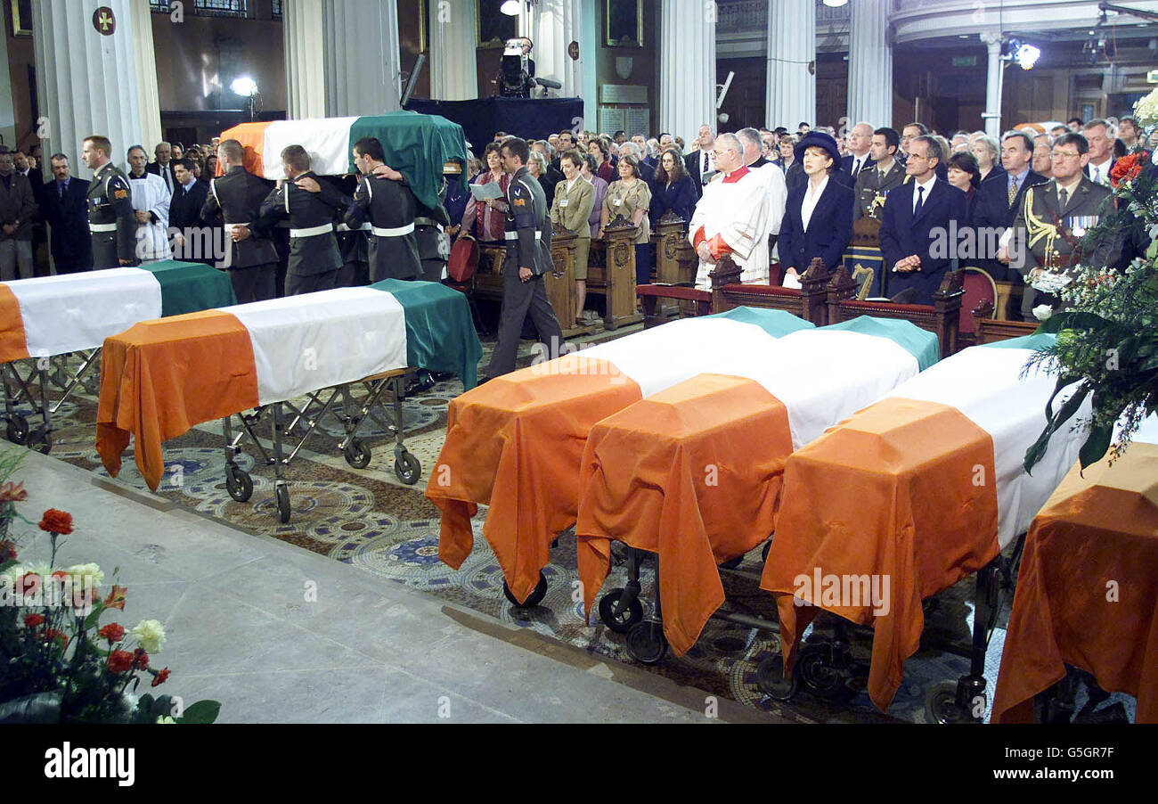The coffins of 10 War of Independence Volunteers are carried into the ...