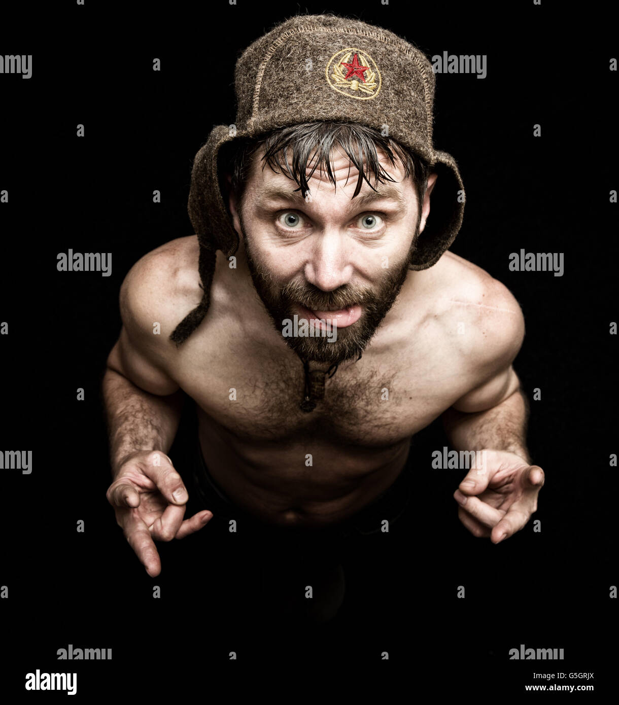 Dark portrait of scary evil sinister bearded man with smirk, makes ...