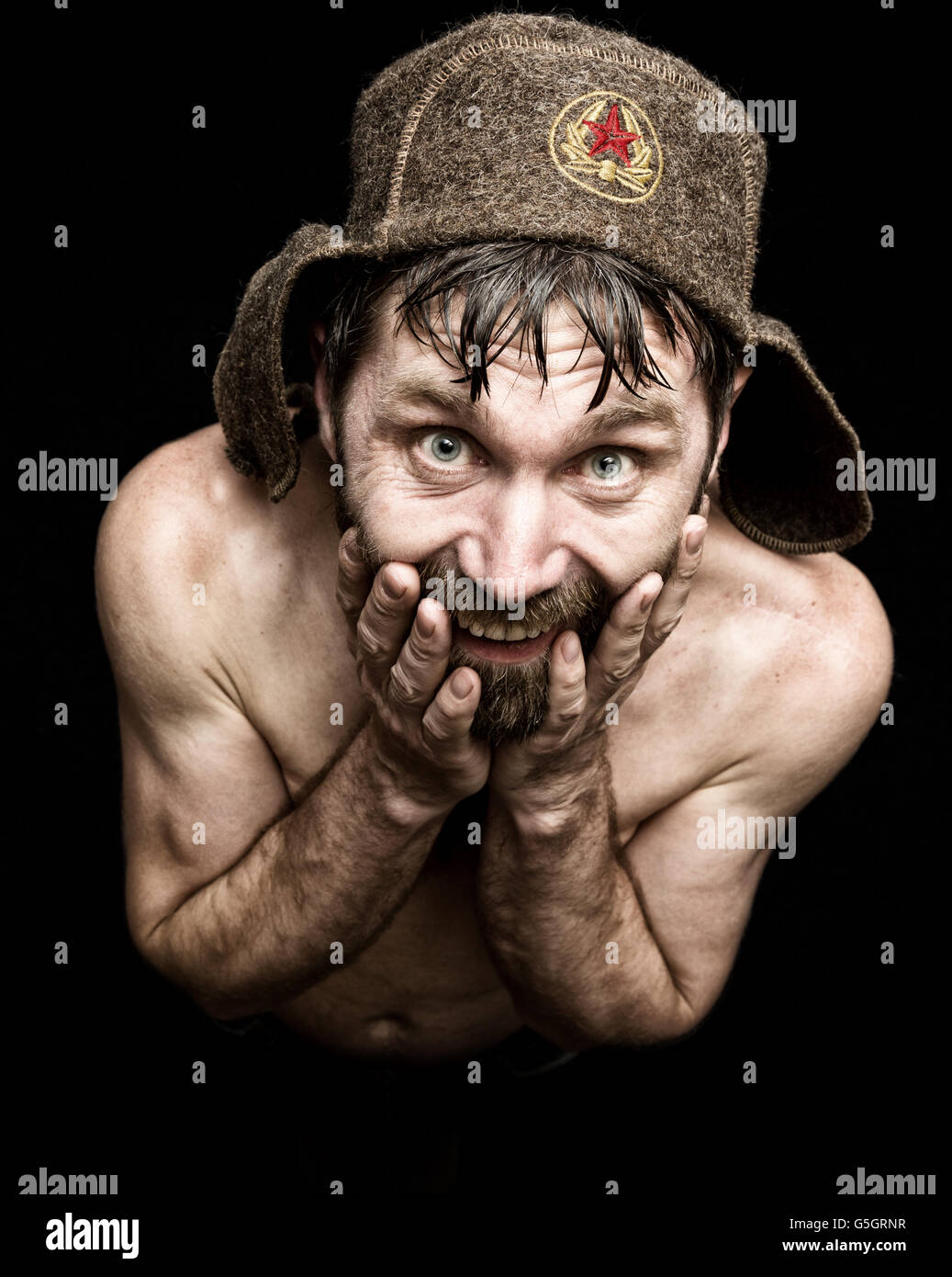 Dark portrait of scary evil sinister bearded man with smirk, makes ...