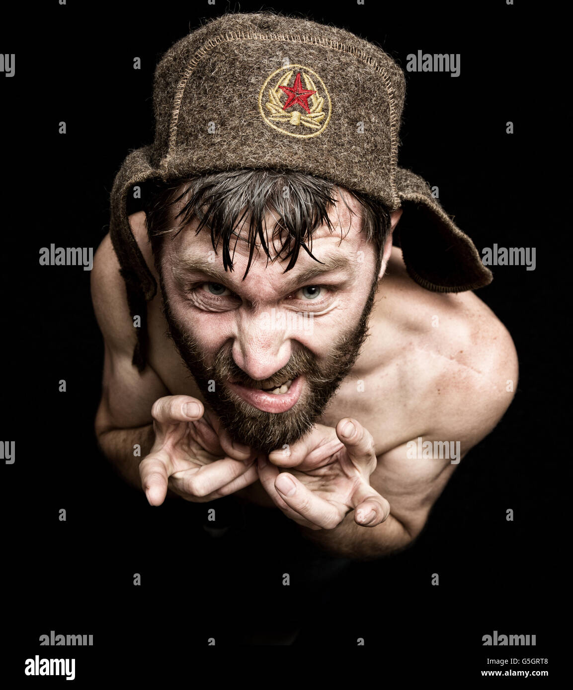 Dark portrait of scary evil sinister bearded man with smirk, makes ...