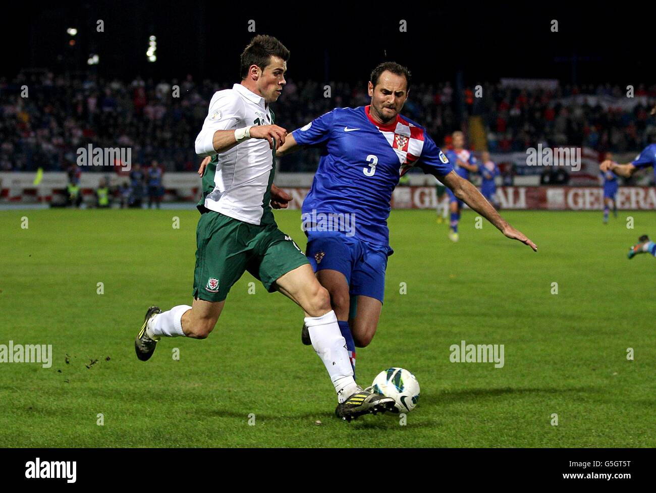 Wales' Gareth Bale (left) is fouled by Croatia's Josip Simunic Stock ...