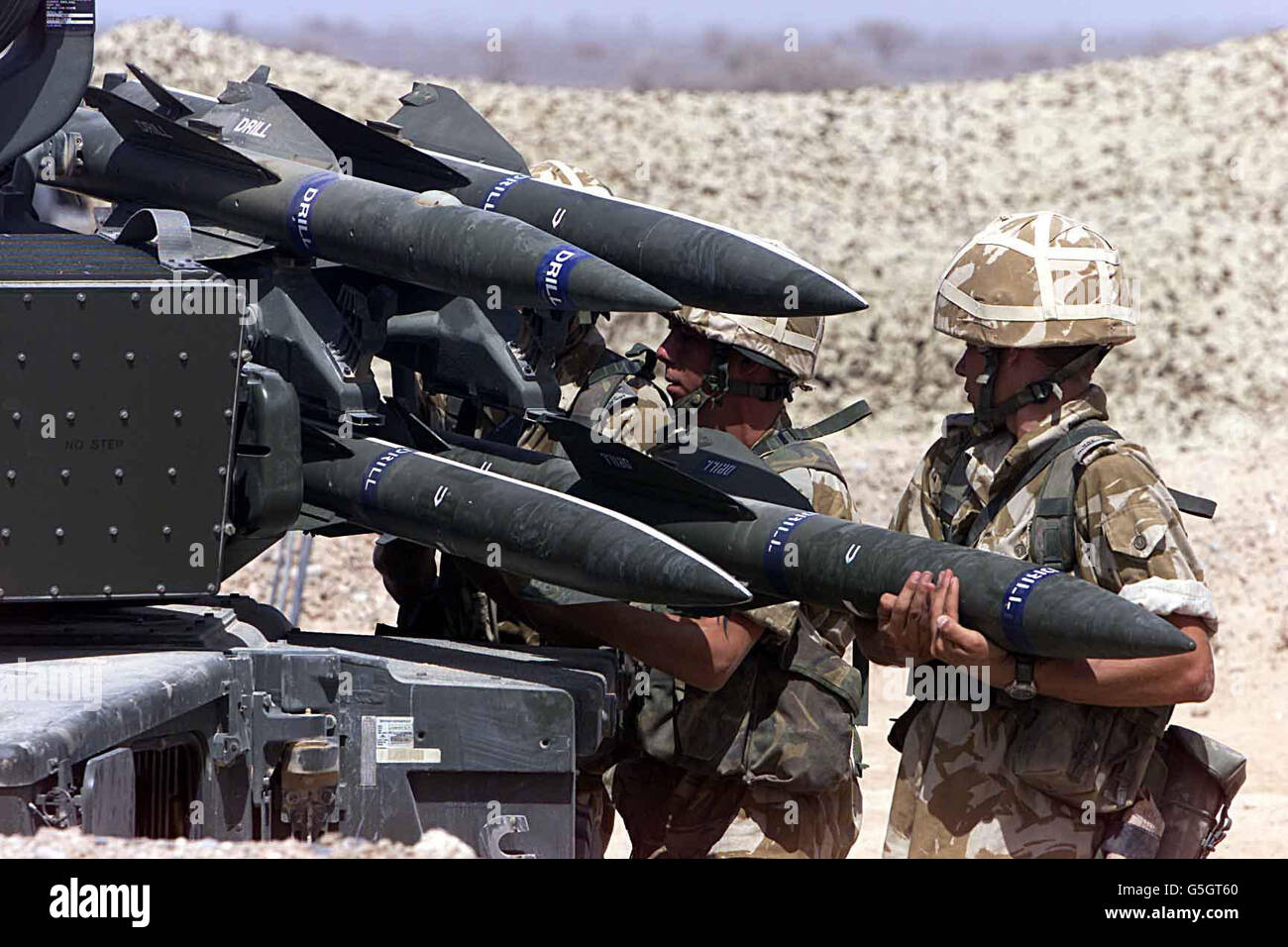 Members from the 26 Squadron RAF Regiment load a Rapier field Standard ...
