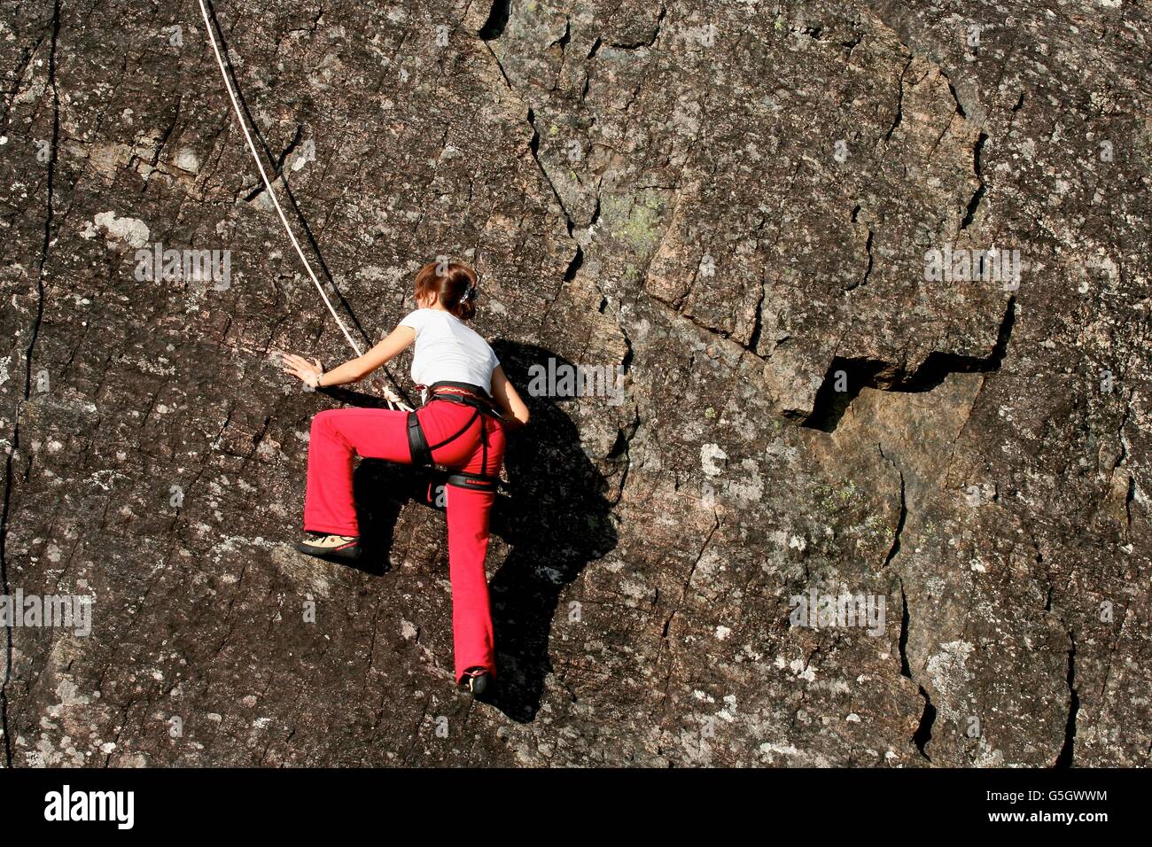 Beautiful and fit girl rock climbing Stock Photo - Alamy