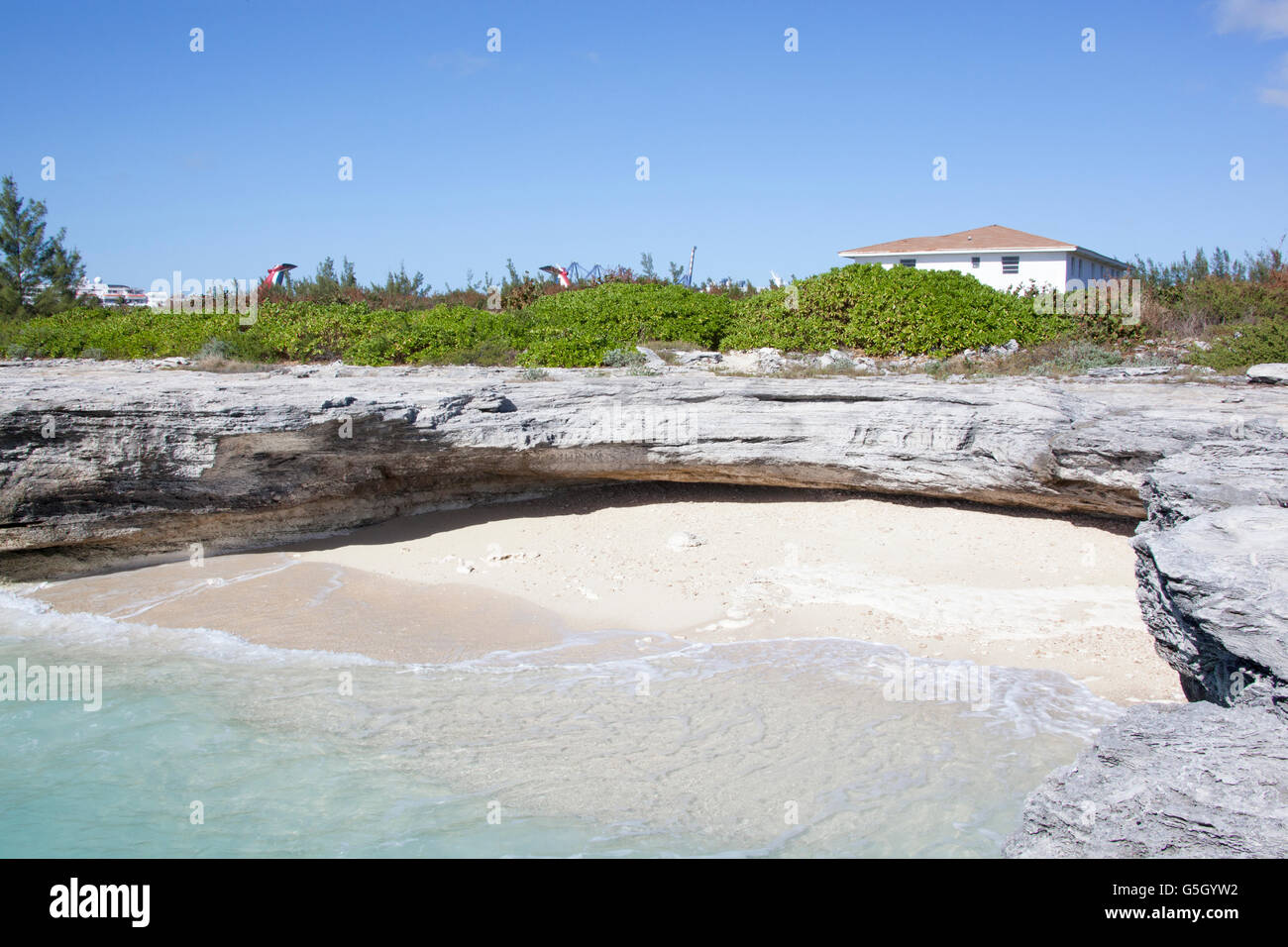The very small beach surrounded by eroded rocks (Grand Bahama Island ...