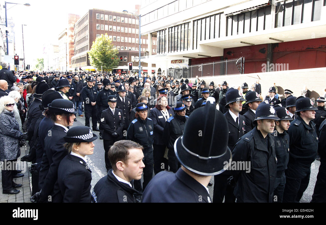 Police officers march behind the funeral cortege of Pc Nicola Hughes ...