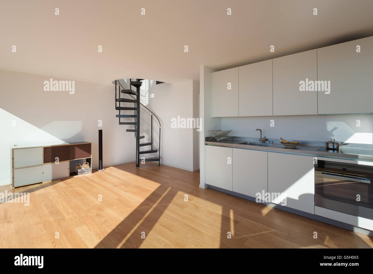 Interior, wide open space of a loft, kitchen and living Stock Photo - Alamy