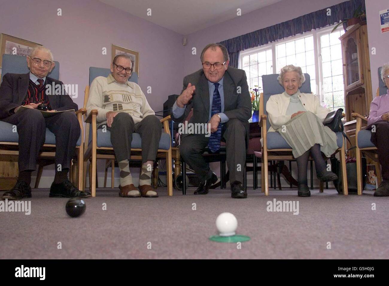 Deputy party leader Alan Beith (centre) plays carpet bowls with patrons ...