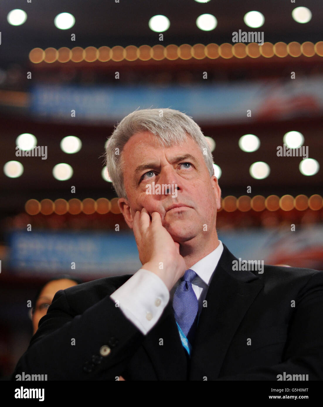 Former health secretary Andrew Lansley listens to his successor Jeremy ...